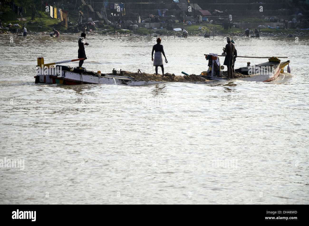 men dredging cleaning River Godavari Rajahmundry Andhra Pradesh India ...