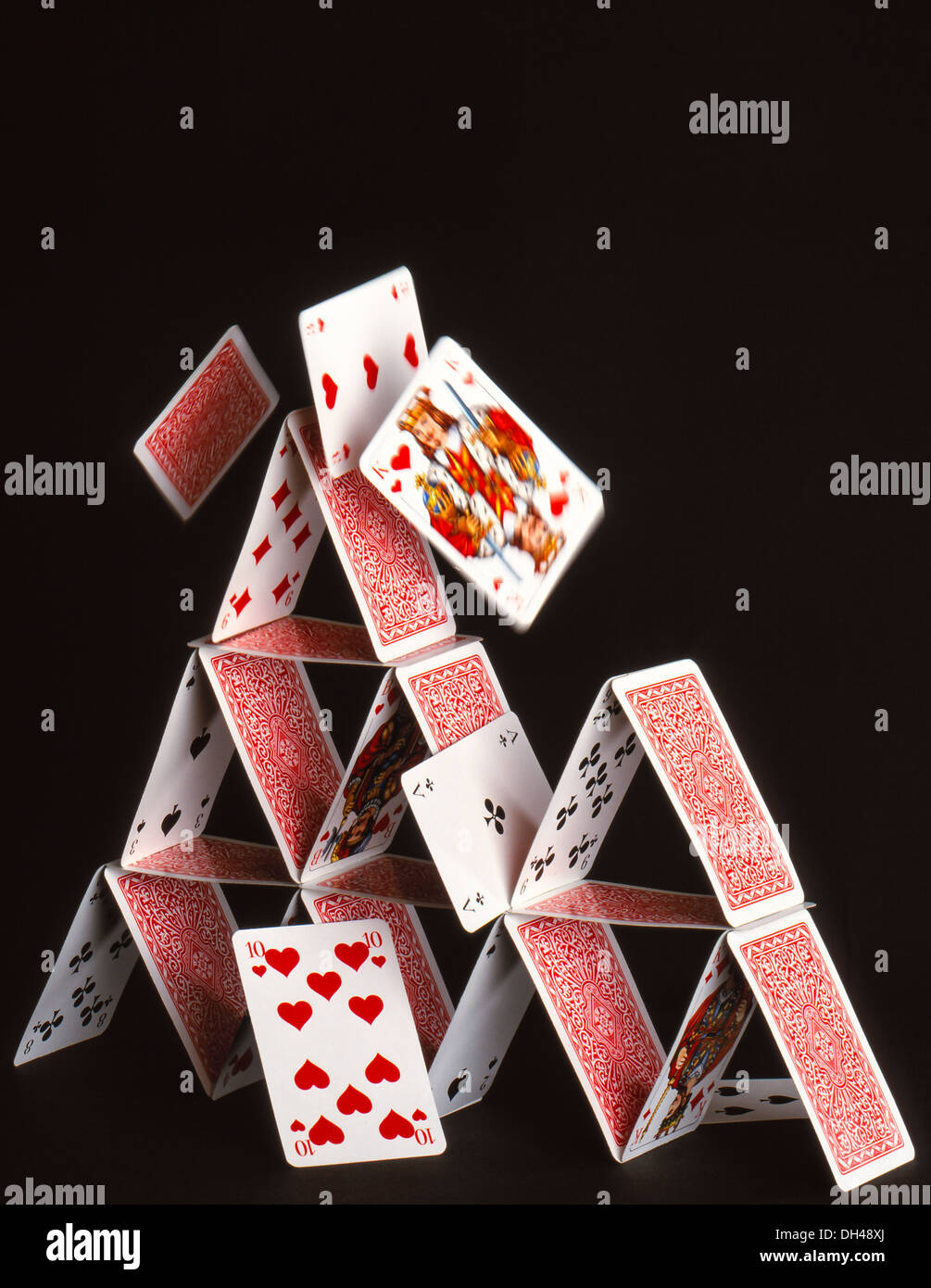 A house of cards collapses Stock Photo - Alamy
