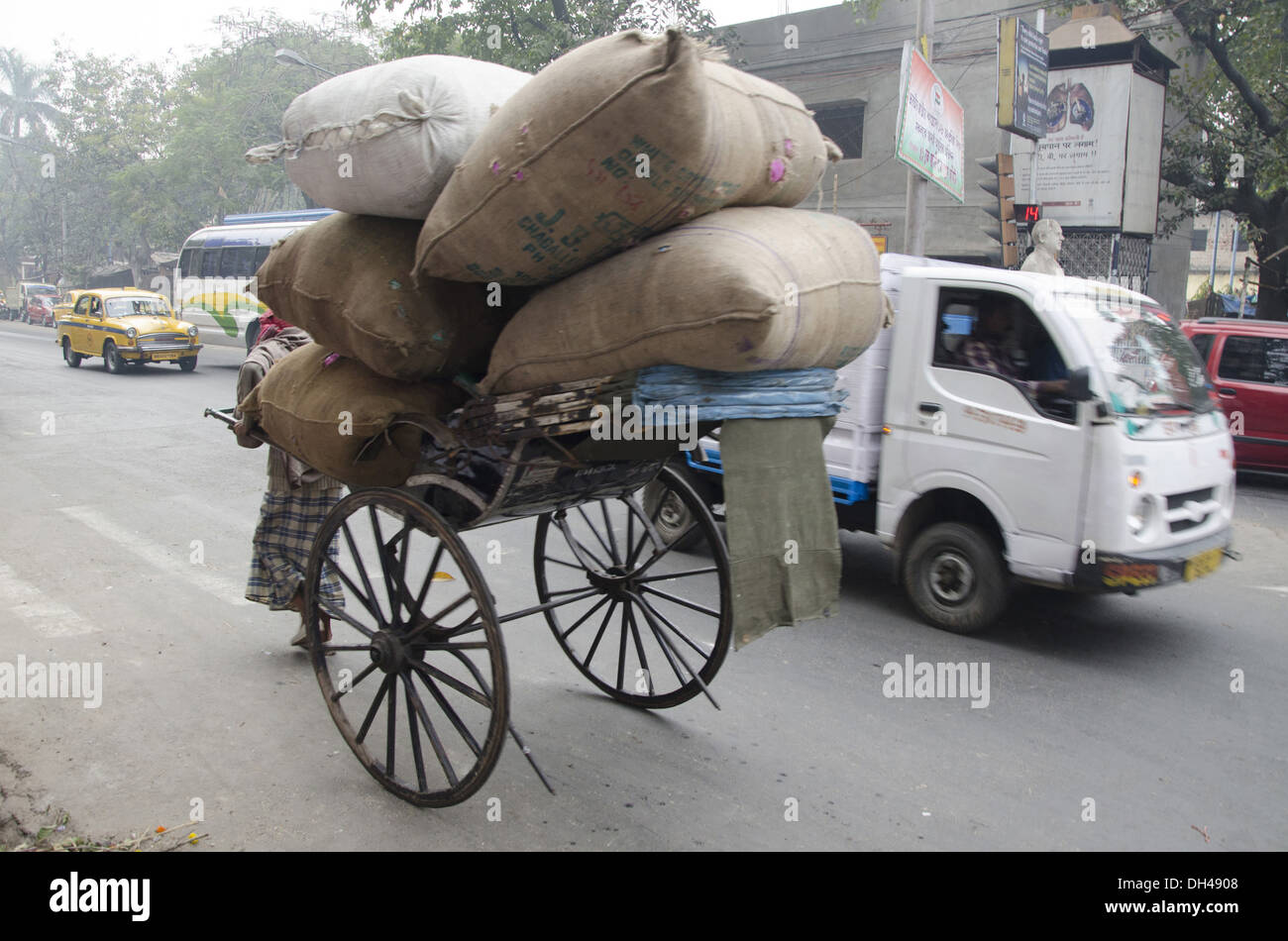 hand rickshaw puller carrying sacks kolkata West Bengal India Stock ...