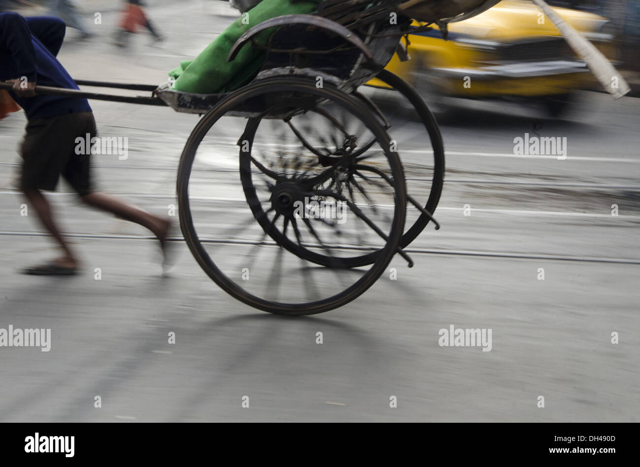 Indian man pulling rickshaw passenger hi-res stock photography and ...