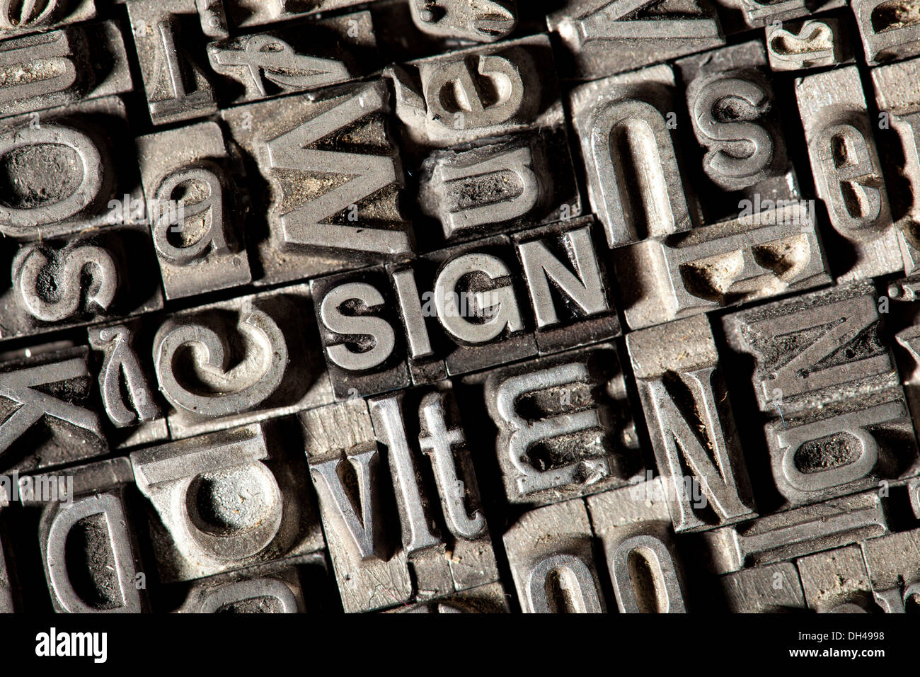 Old lead letters forming the word SIGN Stock Photo - Alamy