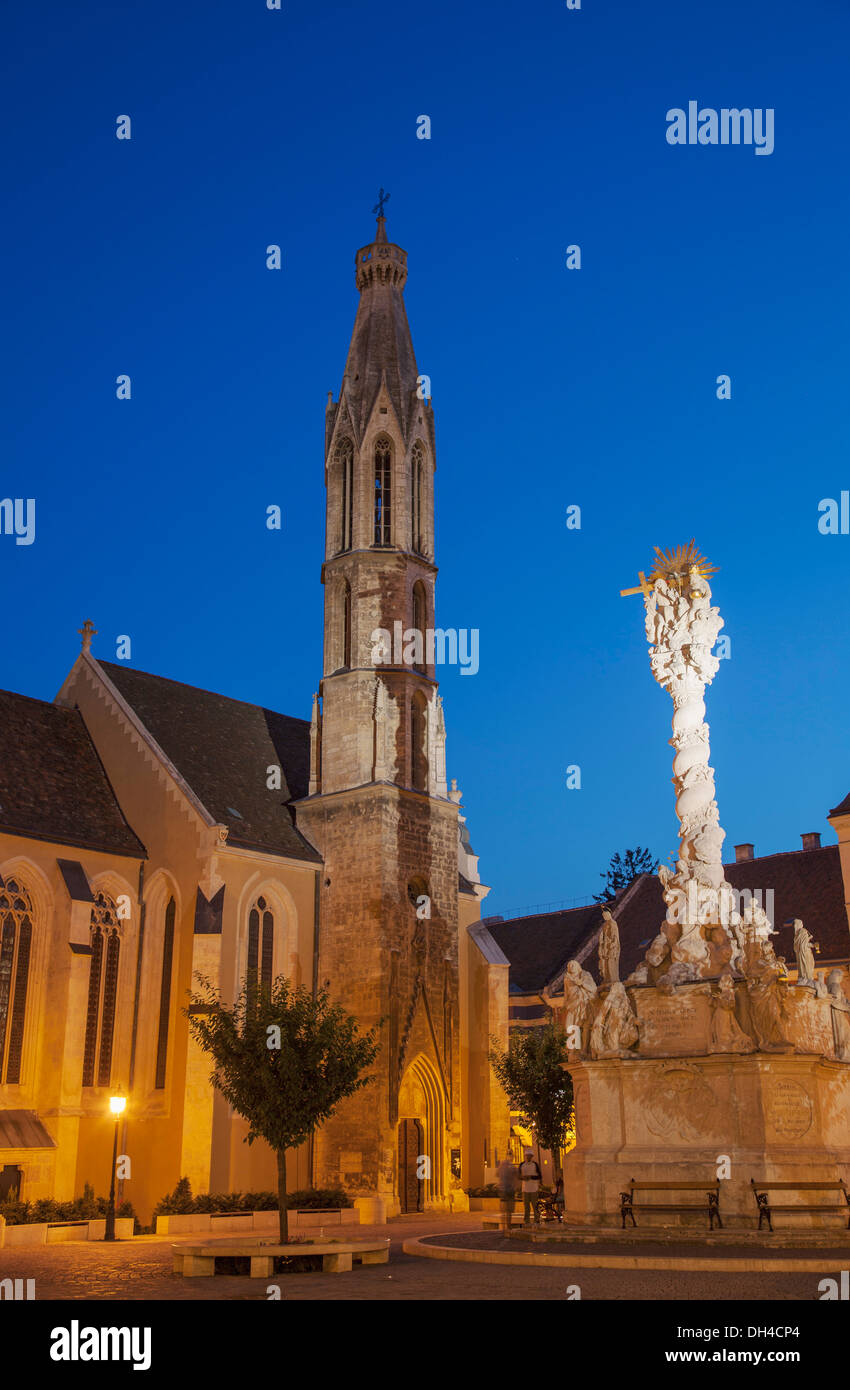 Goat Church and Trinity Column in Main Square at dusk, Sopron, Western ...