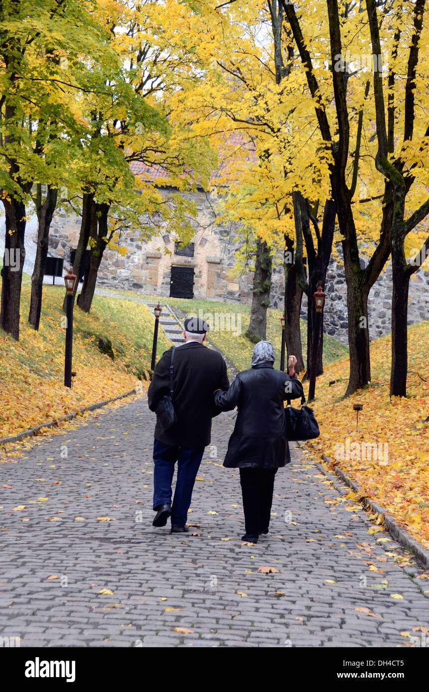 Old Couple Walking Hand In Hand