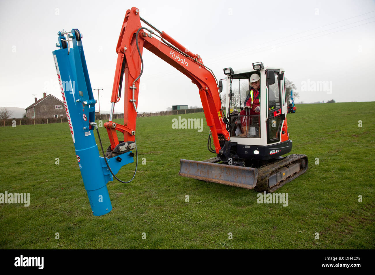 Post Puncher attachement in action UK Stock Photo - Alamy