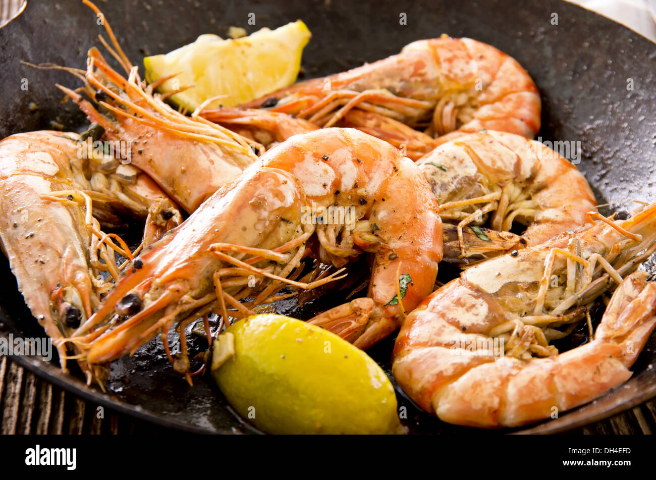 fried gambas with lemon Stock Photo - Alamy