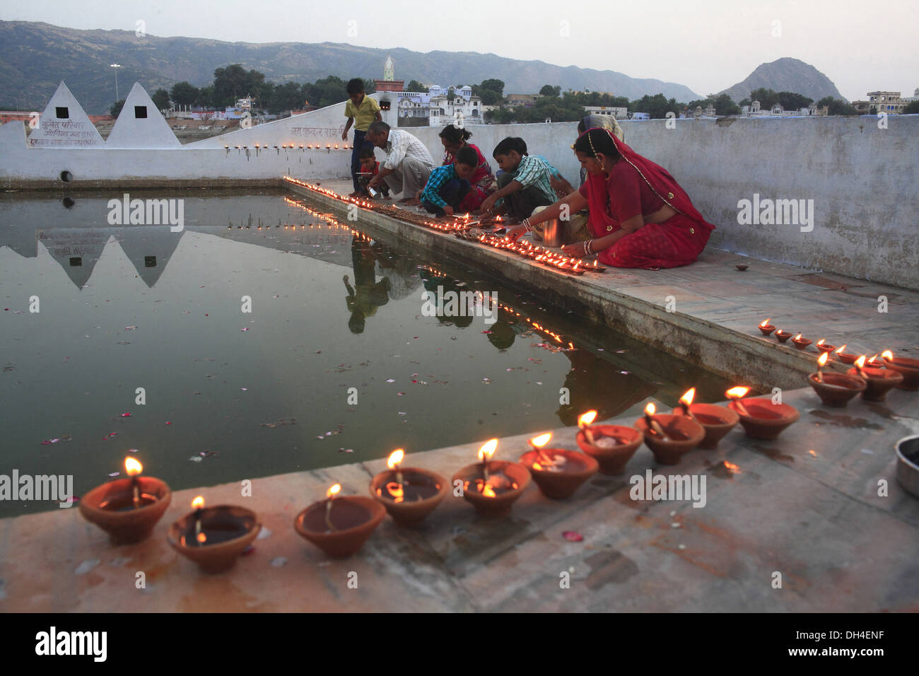 Indian people lighting diyas hi-res stock photography and images - Alamy