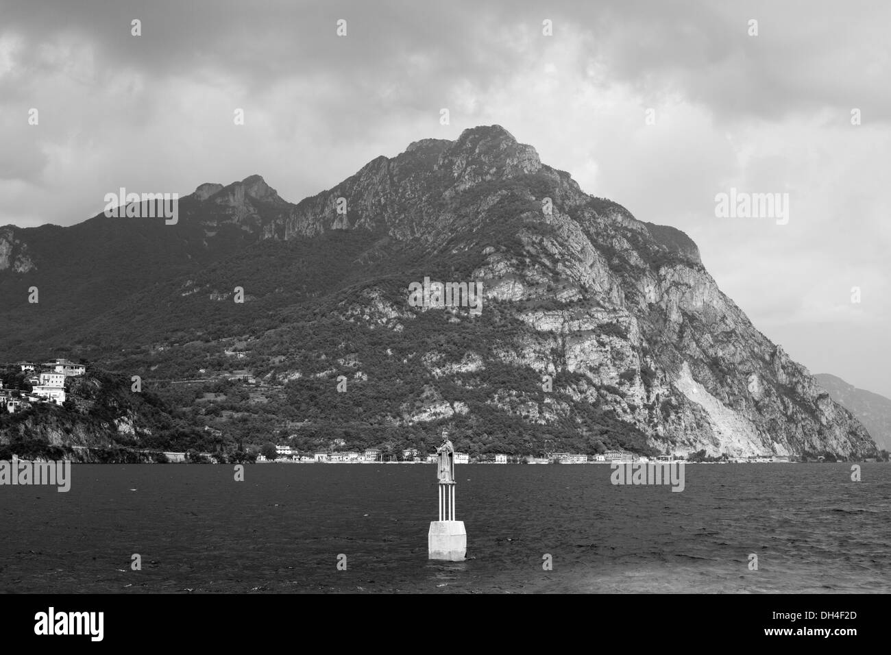 Statue of San Nicolo in Lake Como, Lecco, Italy, with mountains behind ...