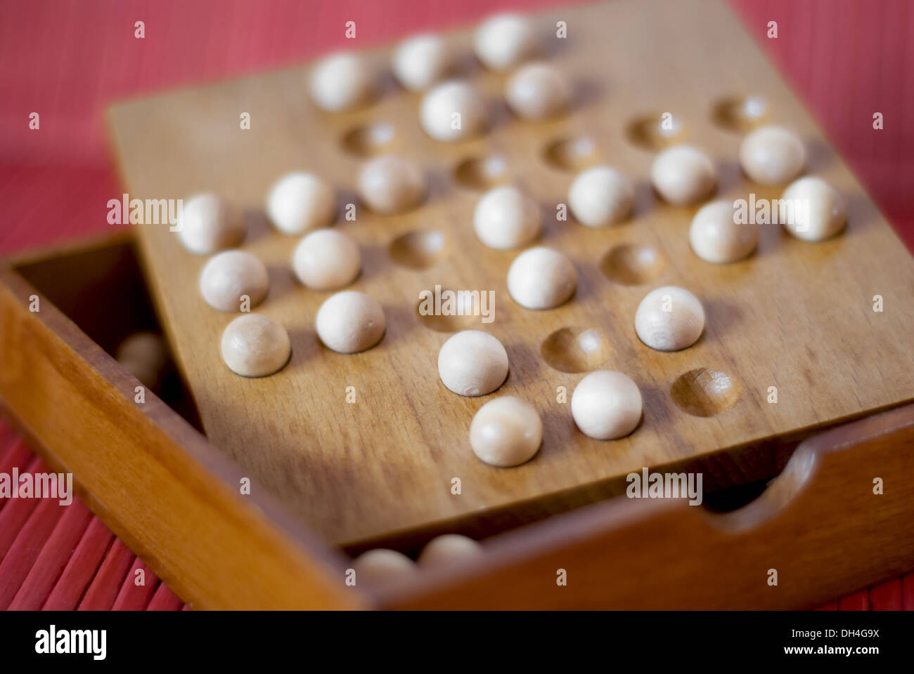 Wooden brain teaser on the table Stock Photo - Alamy