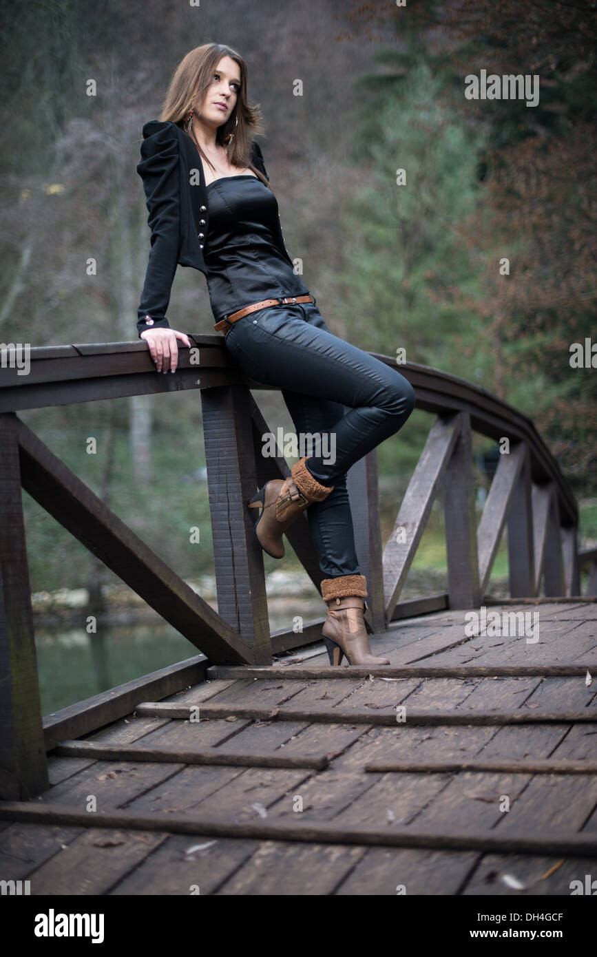 young woman leaning at the bridge Stock Photo - Alamy