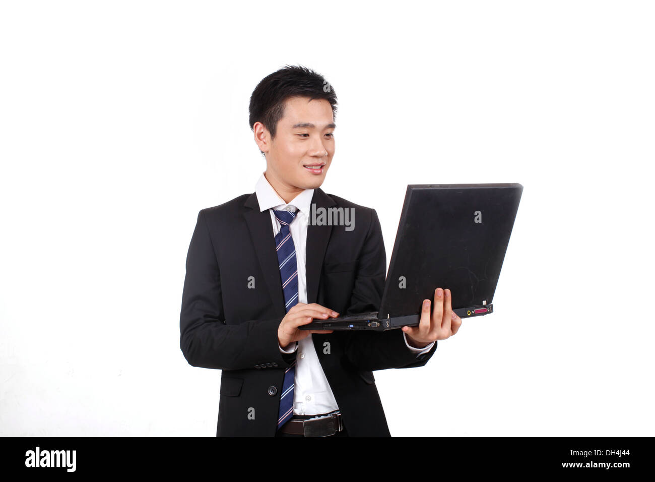 Asian Businessman Holding Laptop Computer Stock Photo - Alamy