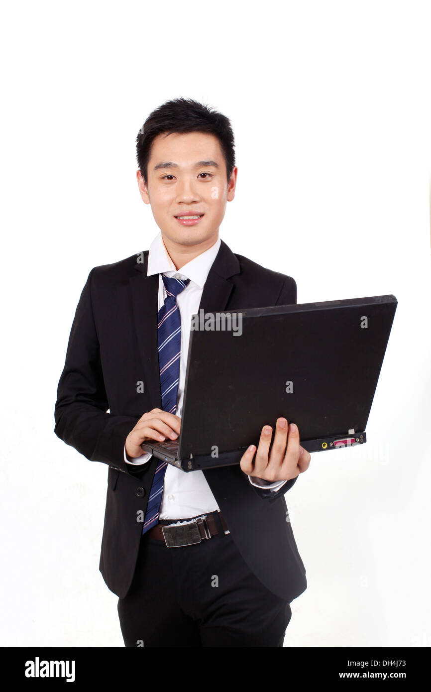 Asian Businessman Holding Laptop Computer Stock Photo - Alamy