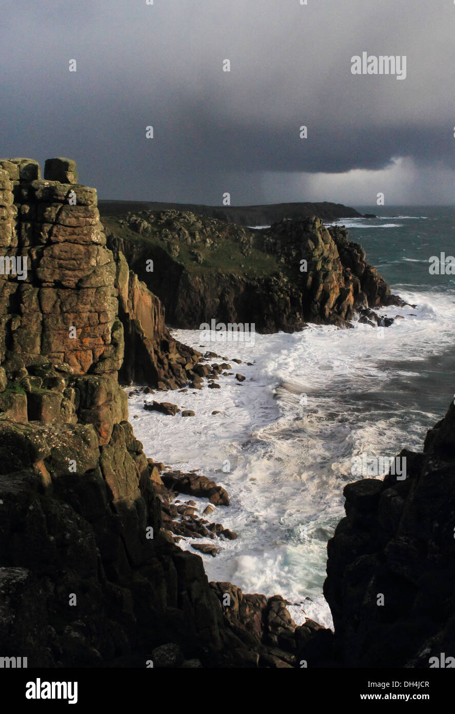 Rugged coastline and rough sea at Lands End, Cornwall, UK Stock Photo ...