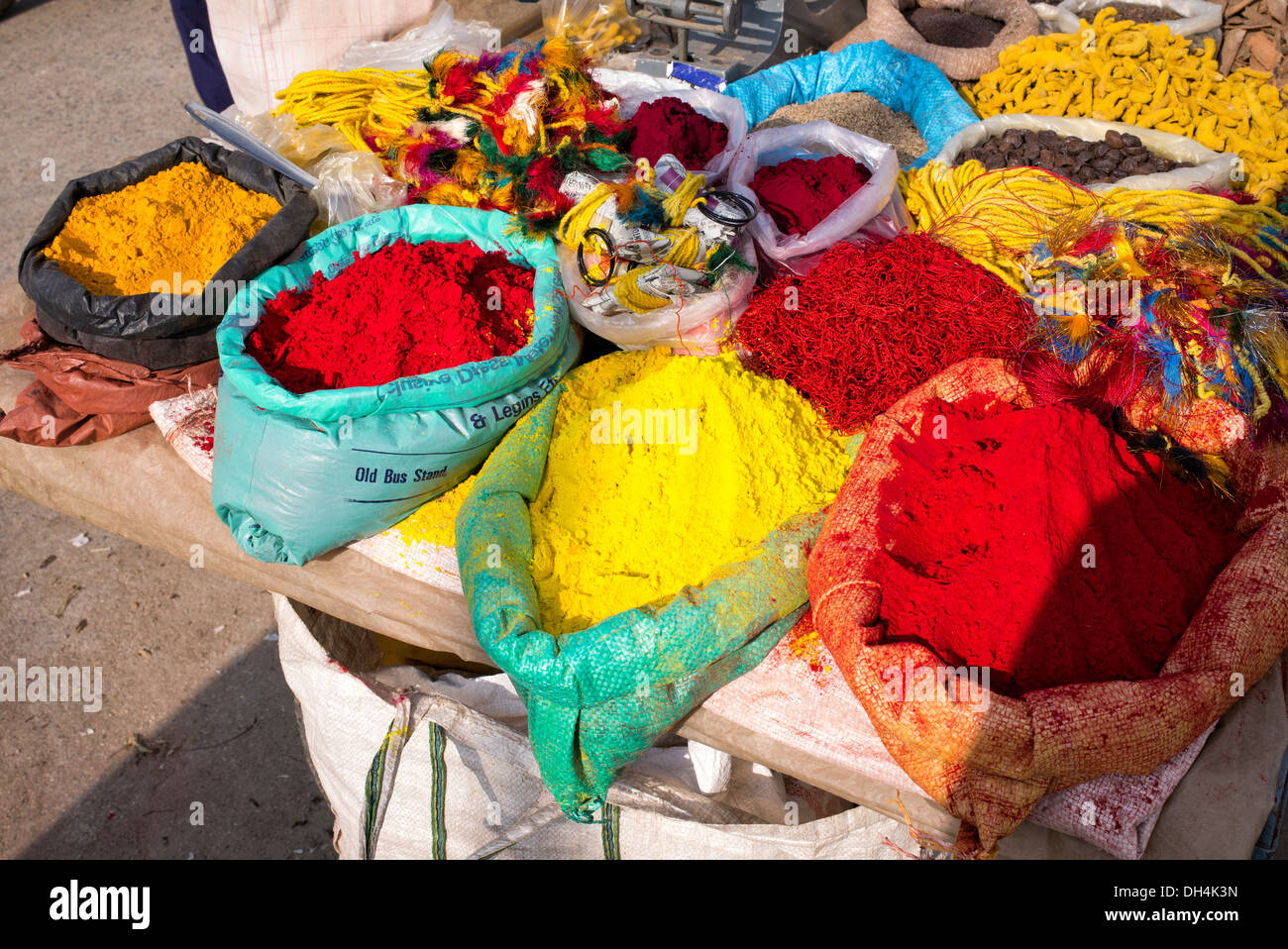 Bags of coloured powder at an Indian street market. Andhra Pradesh ...