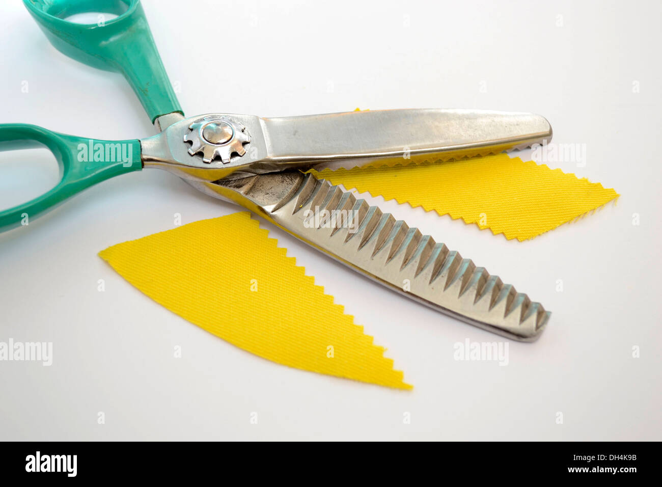 shears curly edges of the material handling Stock Photo - Alamy