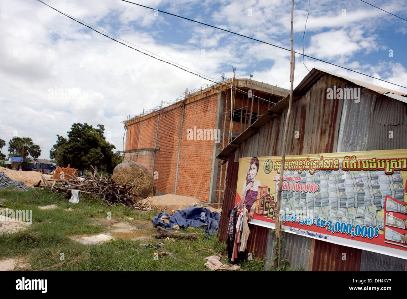 A new brick and cement home is being built on the outskirts of Phnom ...