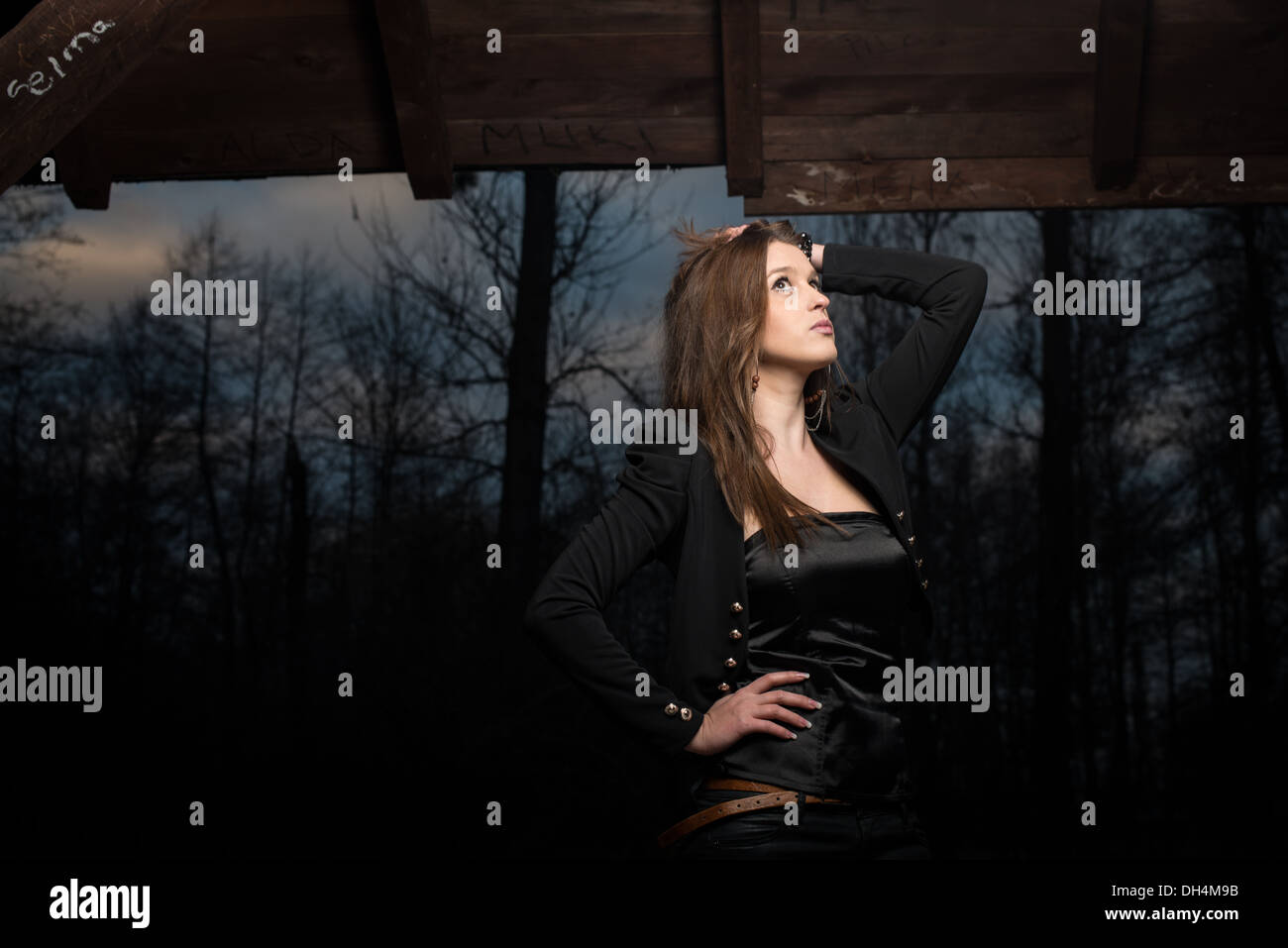 young woman posing and looking up Stock Photo - Alamy