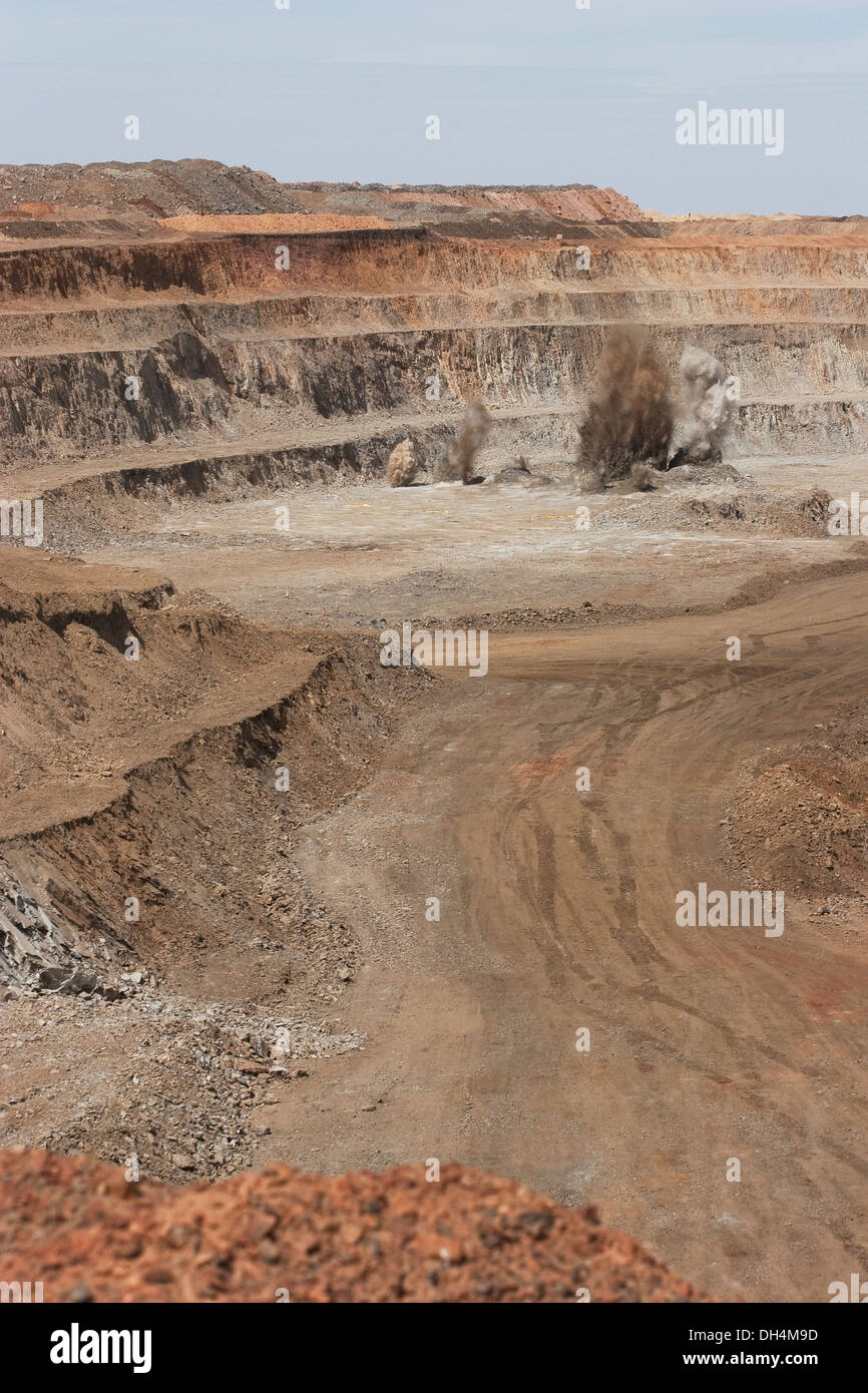 Blasting ore bearing rock in an opencast surface gold mine pit, Western ...