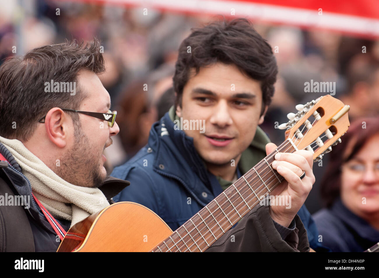 Pilgrims play guitar and singing in St Peter's Square in the audience ...