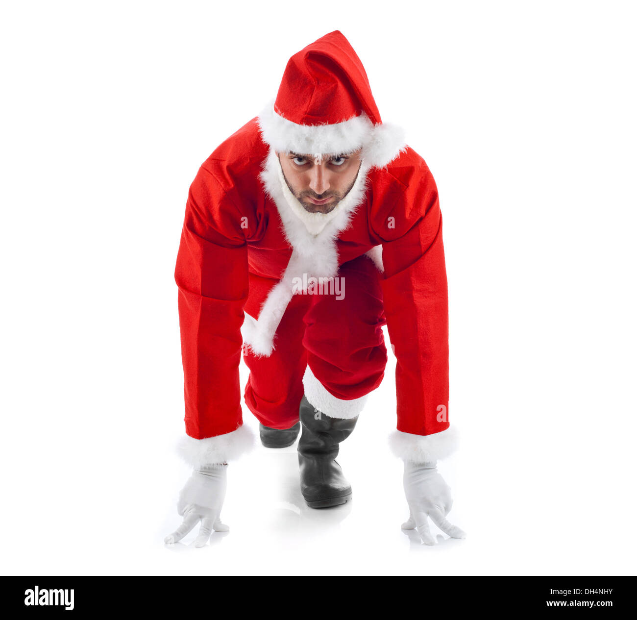 Santa Claus in the starting position on white background Stock Photo ...