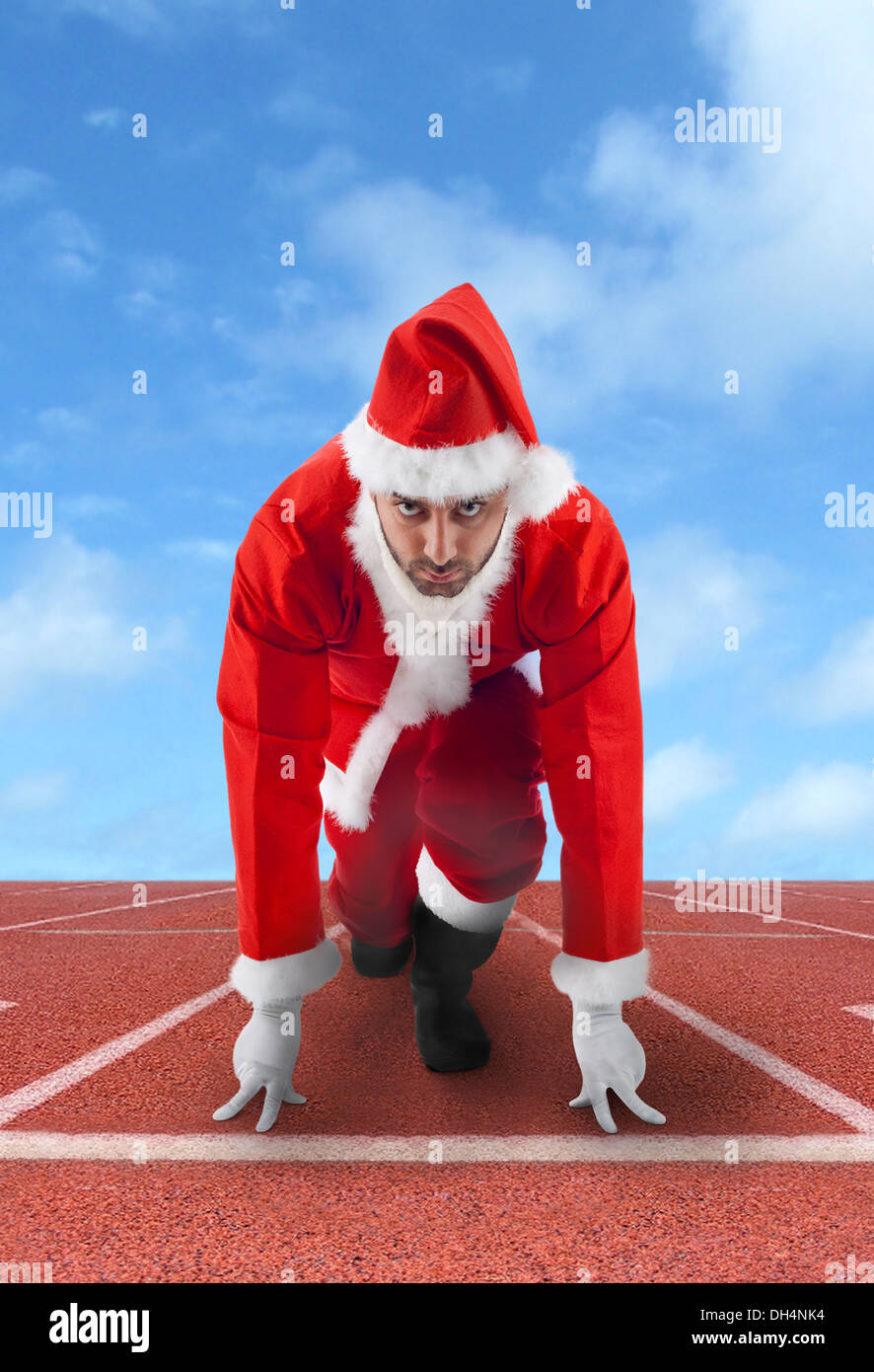 Santa Claus in the starting position on a running track Stock Photo - Alamy