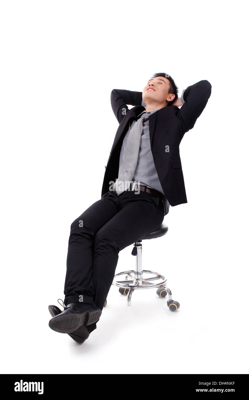 Young businessman relaxed at work Stock Photo - Alamy