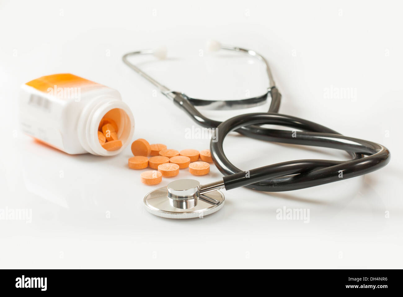 stethoscope and medications in pill form Stock Photo - Alamy