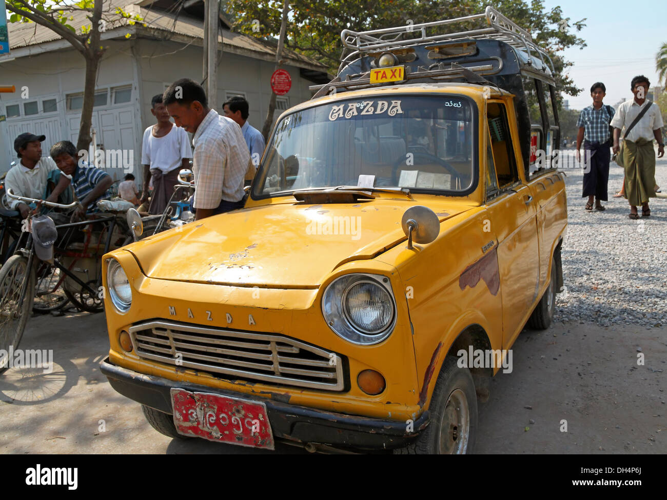 YANGON, MYANMAR - OCTOBER 25, 2012: using retro car Mazda as a taxi in ...