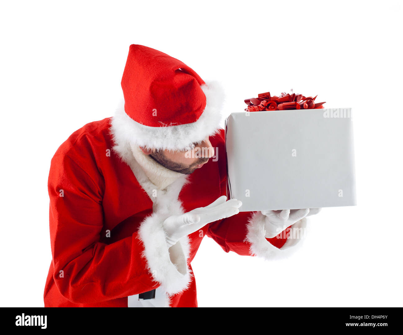 Young Santa Claus with gift box on white background Stock Photo - Alamy