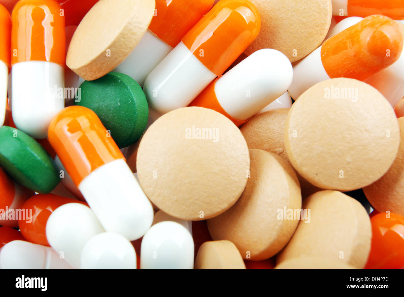 Pills of many shapes and colors grouped together Stock Photo - Alamy