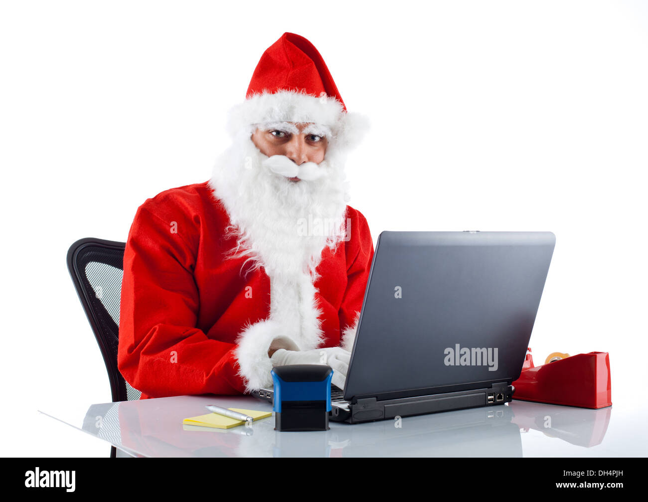 Young Santa Claus with notebook on white background Stock Photo - Alamy