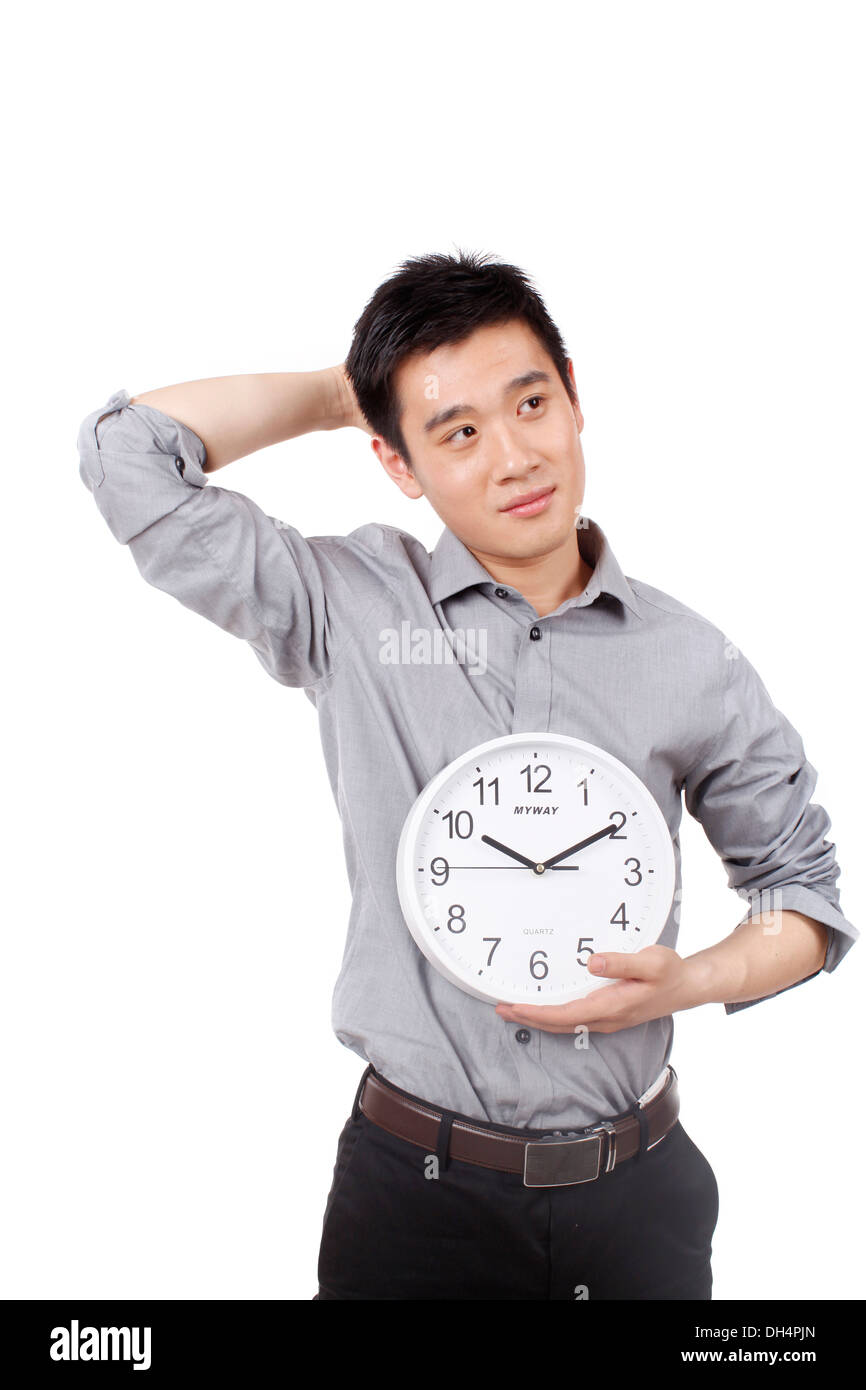 A businessman pointing to a clock Stock Photo - Alamy