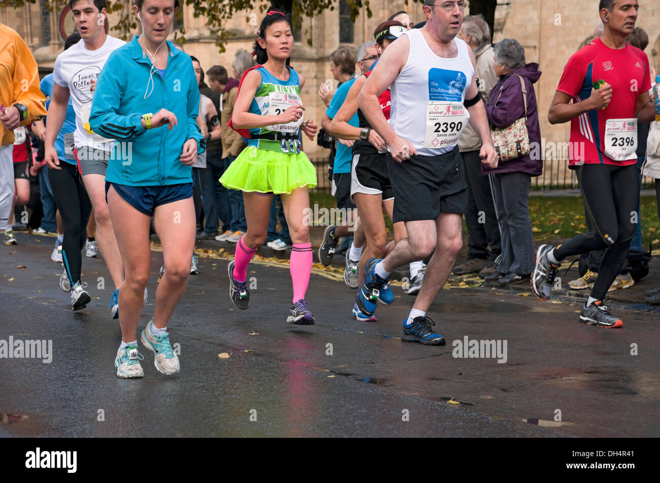 Runner people running in colourful costume in the Yorkshire Marathon ...