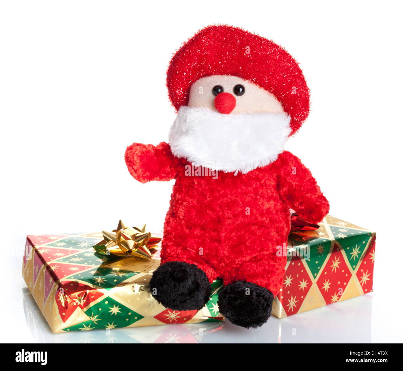 Colorful gift boxes with Santa Claus puppet isolated on white ...