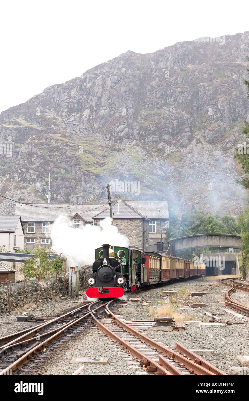 Steam locomotive pulling a passenger train into Blaenau Ffestiniog railway station, Wales Stock ...