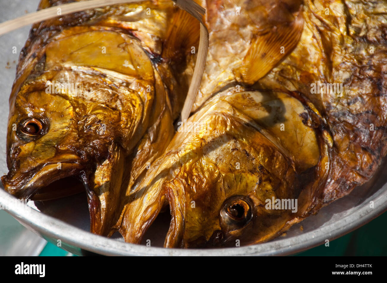 Horizontal close up of dried fish served on a plate in Laos Stock Photo ...