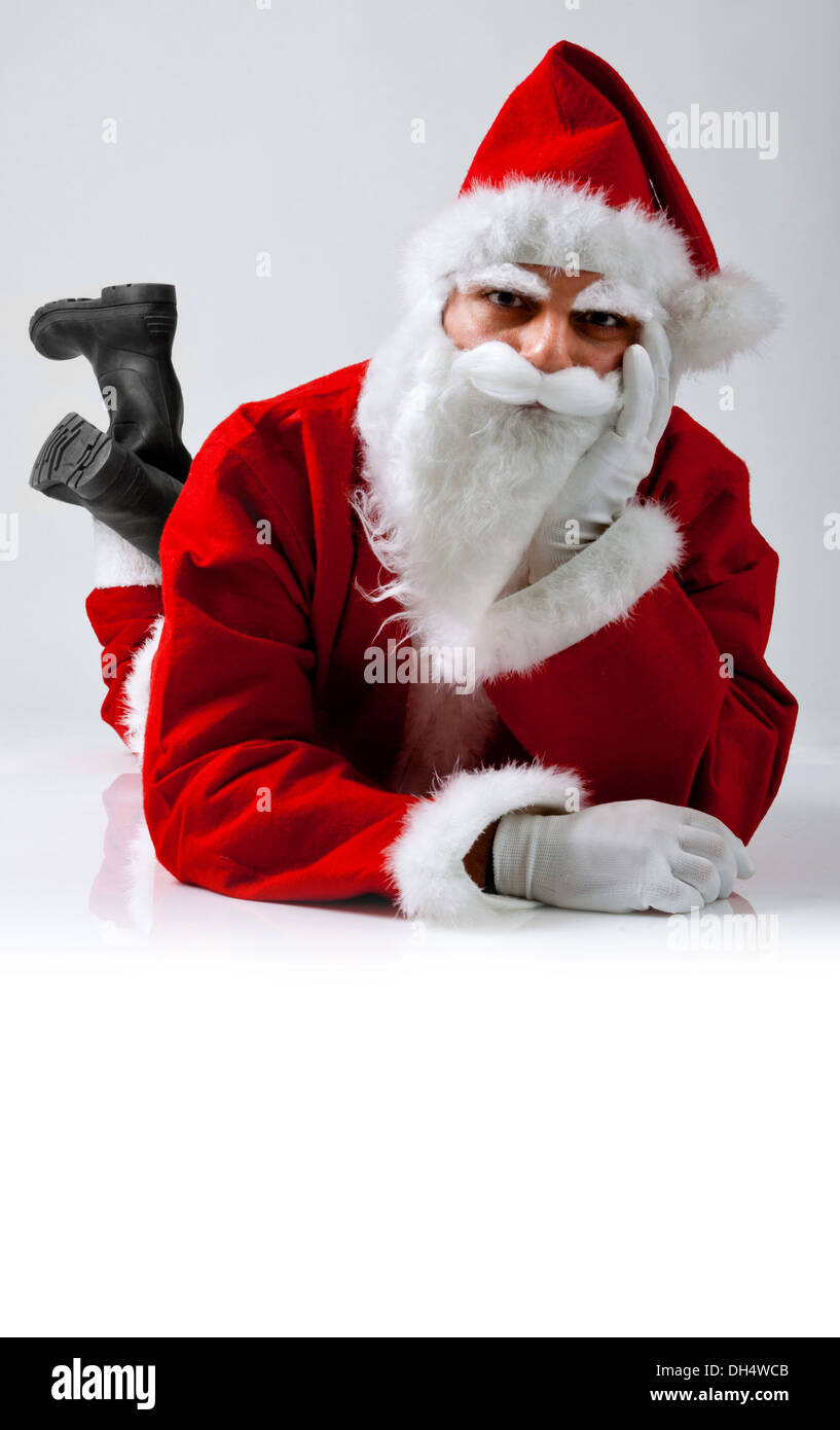 Santa lying down hi-res stock photography and images - Alamy