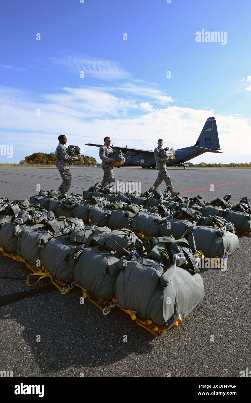 T-11 parachutes lie ready to be issued to paratroopers, assigned to ...