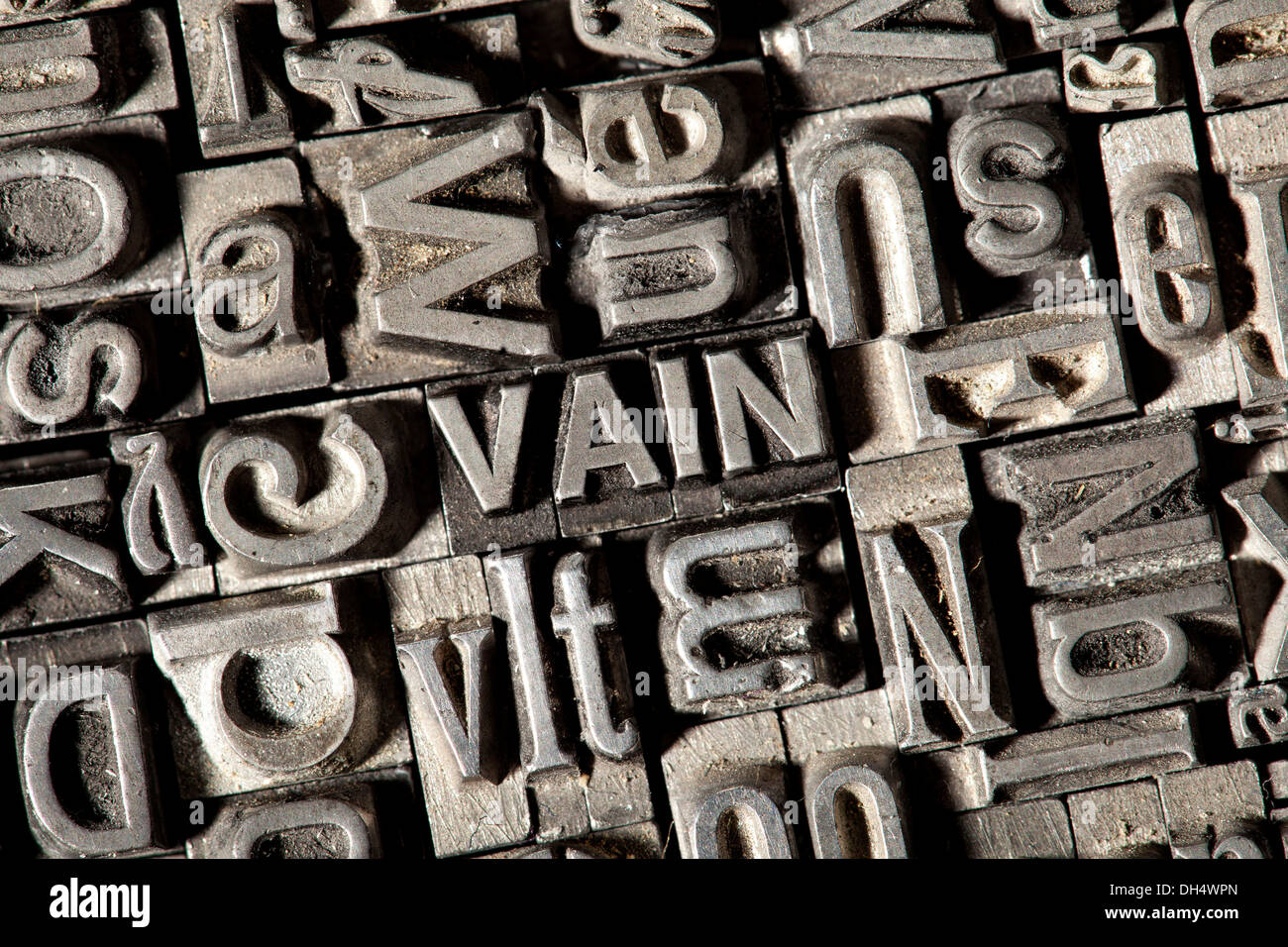 Old lead letters forming the word VAIN Stock Photo - Alamy
