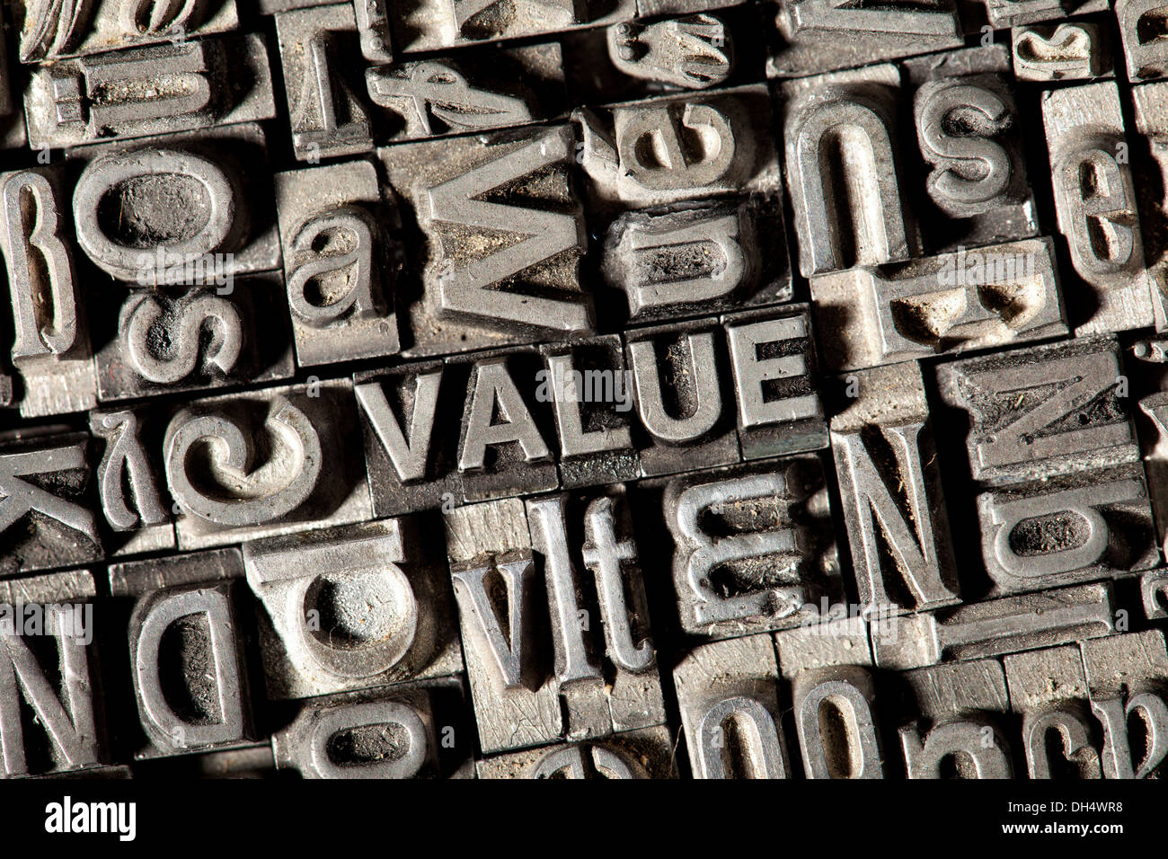 Old lead letters forming the word VALUE Stock Photo - Alamy