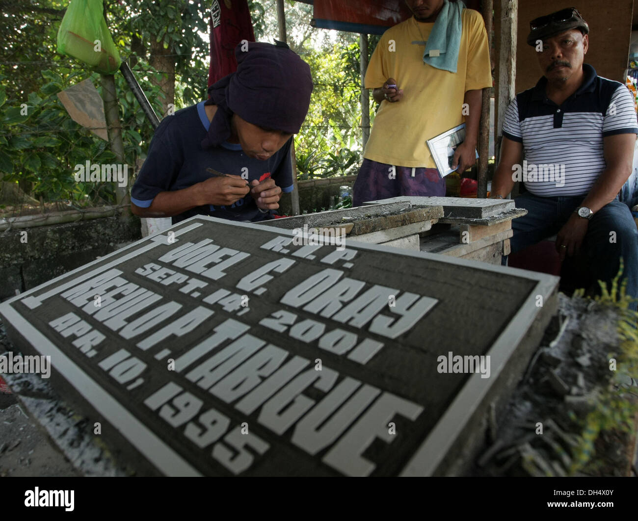 Davao, Philippines. 31st Oct, 2013. Filipino tombstone maker FELIX ...