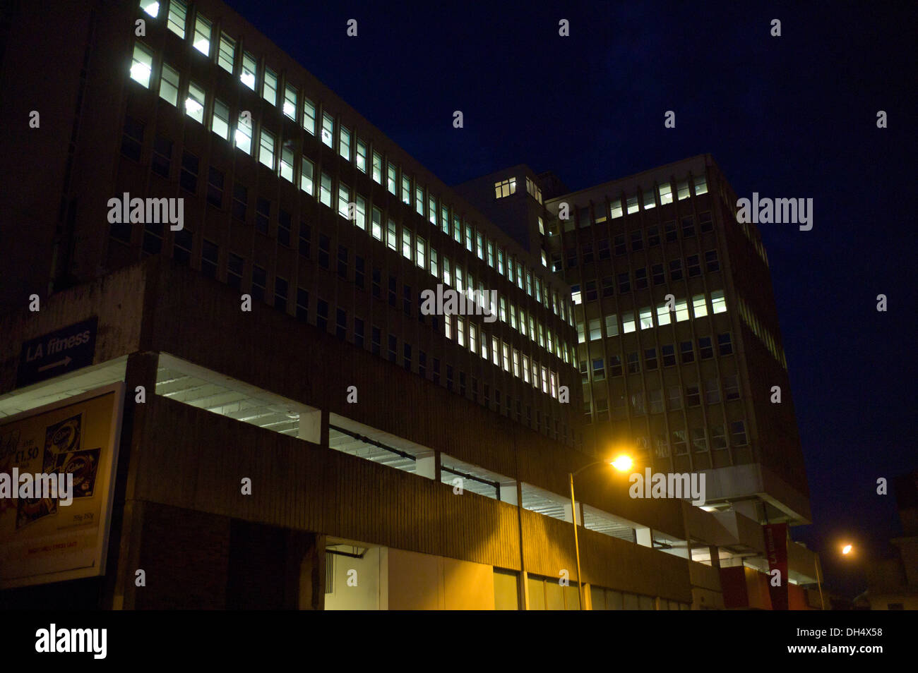 office block at night, illuminated windows, streetlights Stock Photo ...