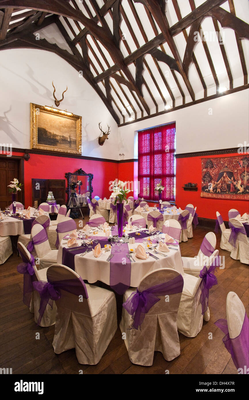 Vertical view of a grand hall in a stately house laid ready for a ...