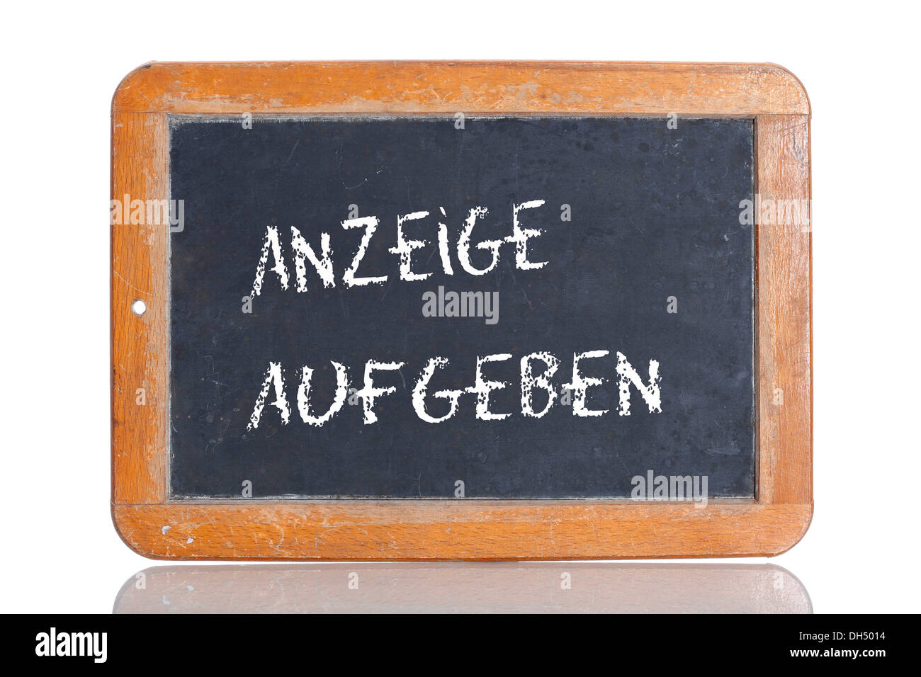 Old chalkboard, lettering "ANZEIGE AUFGEBEN", German for "PLACE AN ...