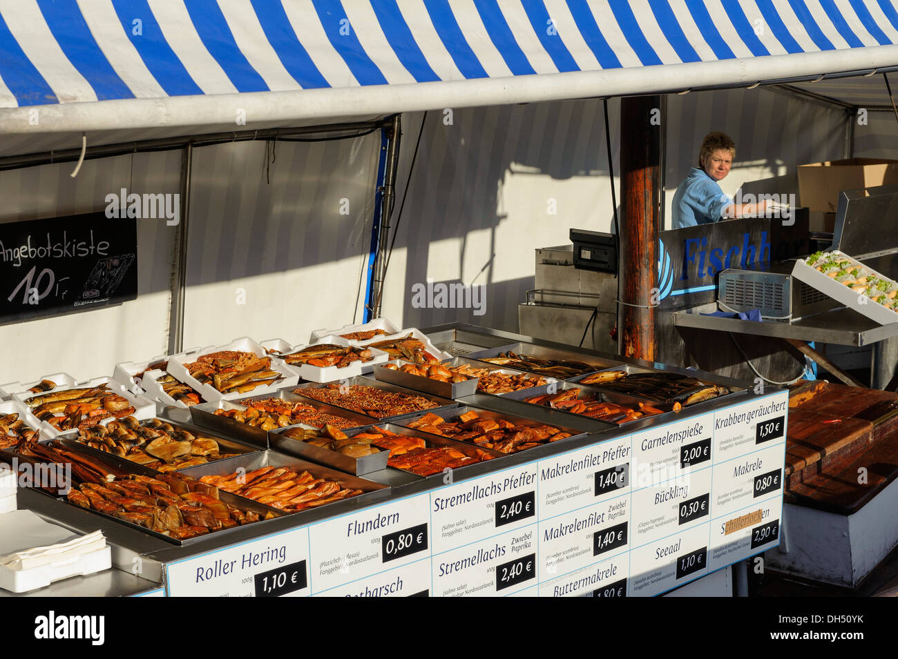 Fishmonger on boats in the old harbor, Hanseatic city of Wismar ...