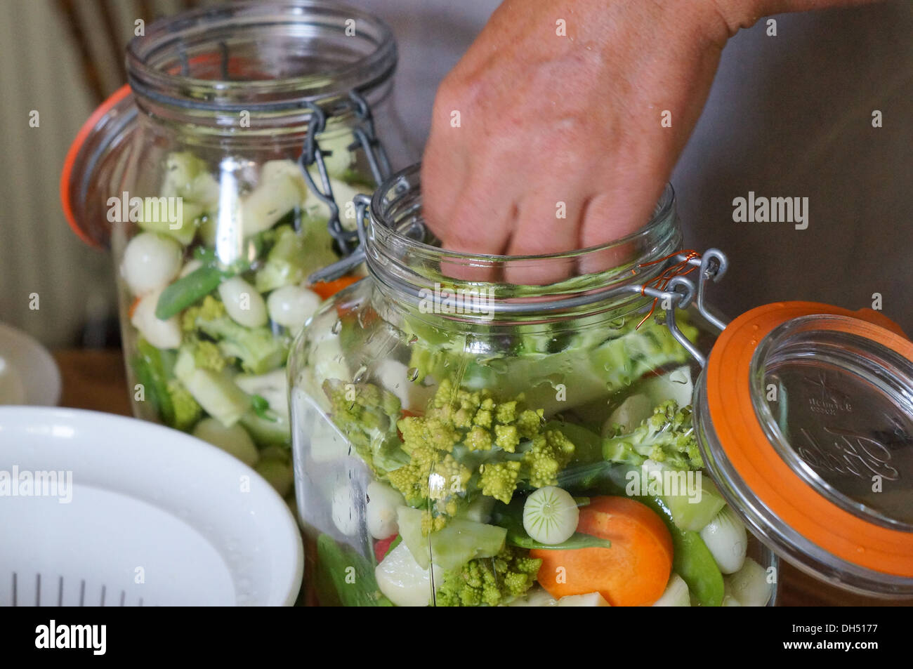 Fermenting vegetables in glass jar,prepare Stock Photo - Alamy