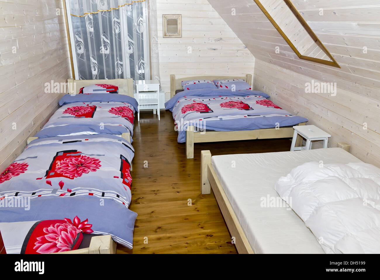 Bedroom in rural pension hotel Stock Photo - Alamy