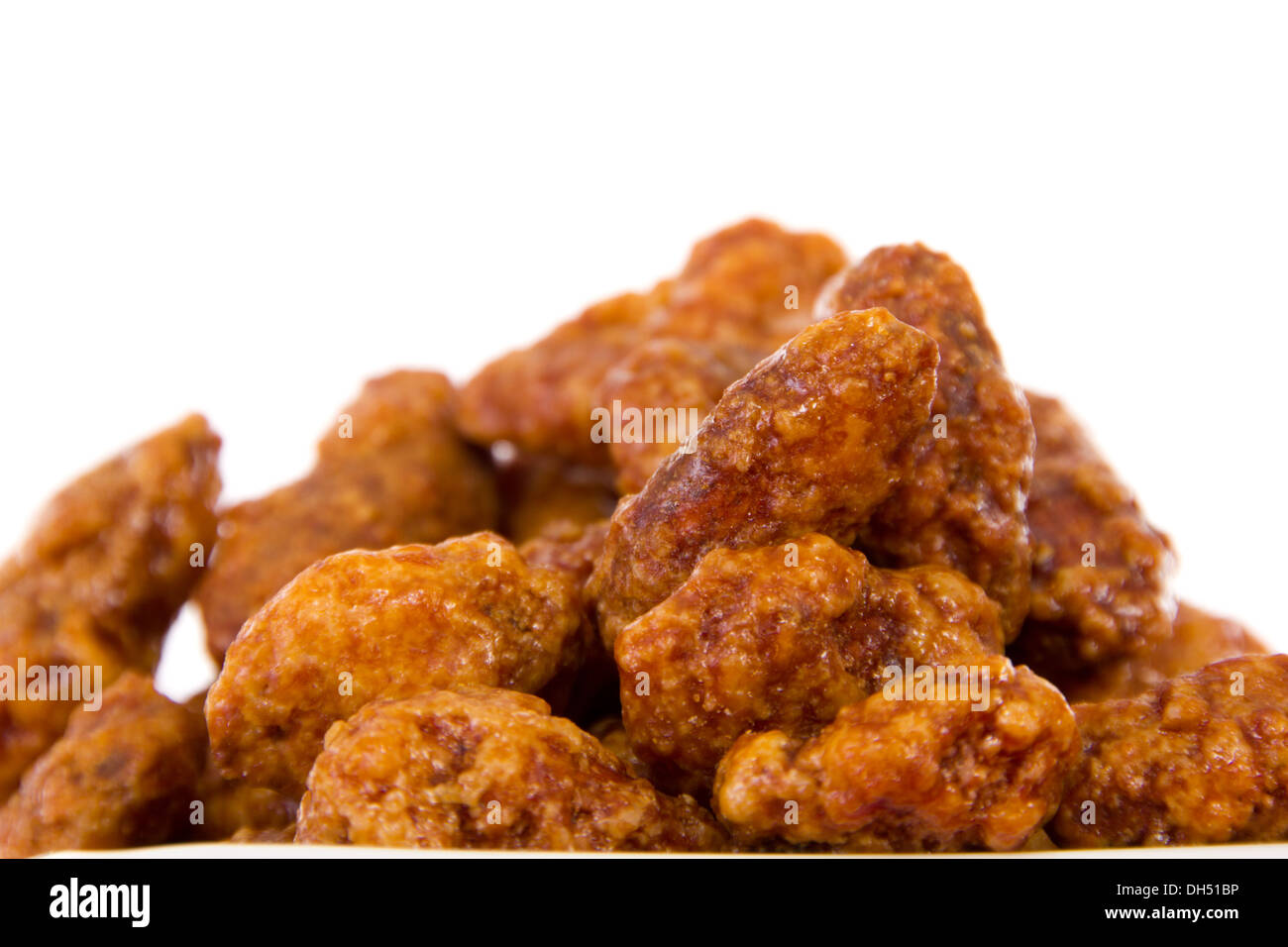 Burnt almonds isolated on white background Stock Photo - Alamy