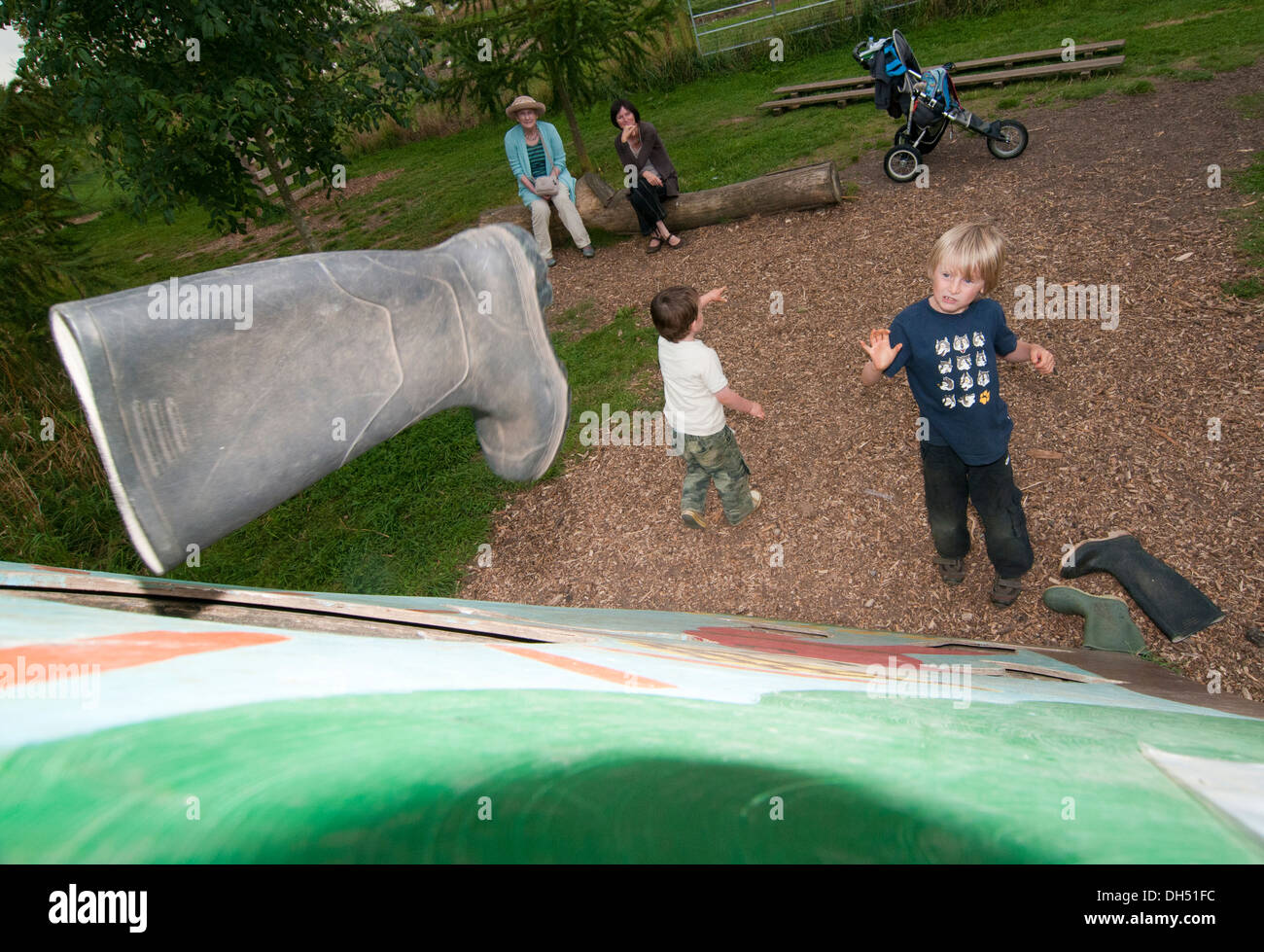Boy wellie throwing Stock Photo - Alamy