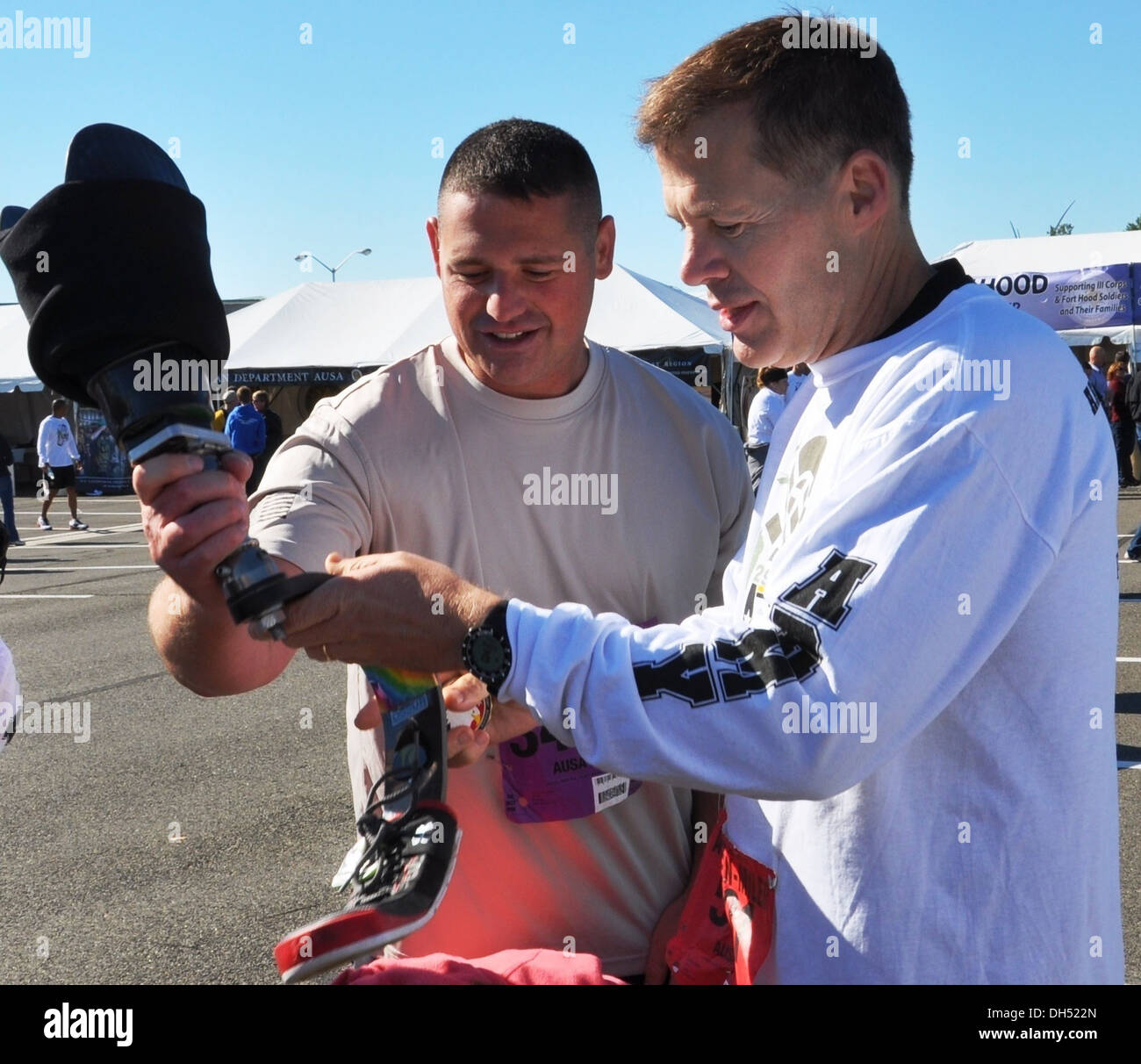 Staff Sgt. Daniel Burgess explains his custom running prosthetic to Lt ...