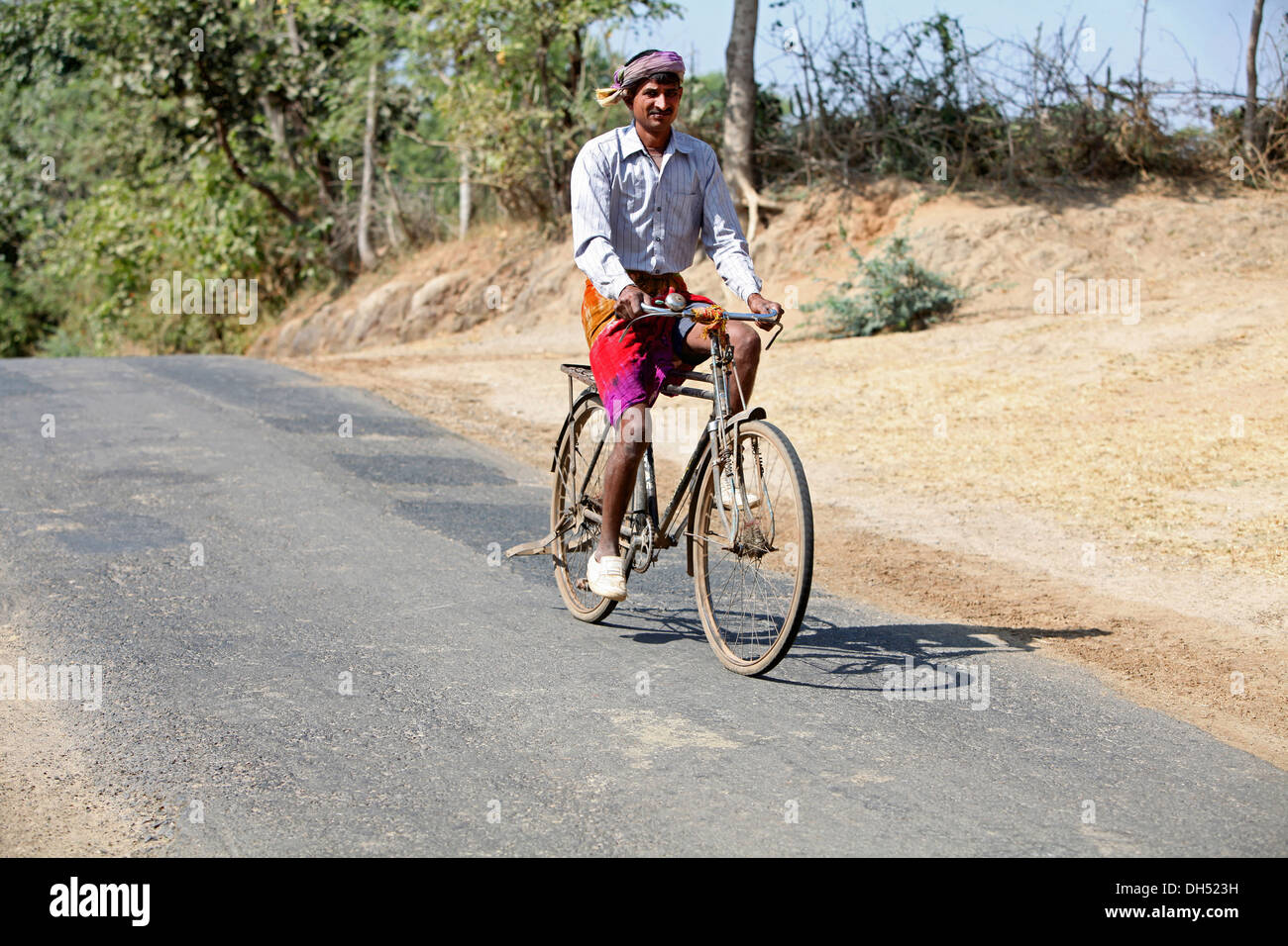 Tribal man on cycle, Bhil Tribe, Madhya Pradesh, India Stock Photo - Alamy